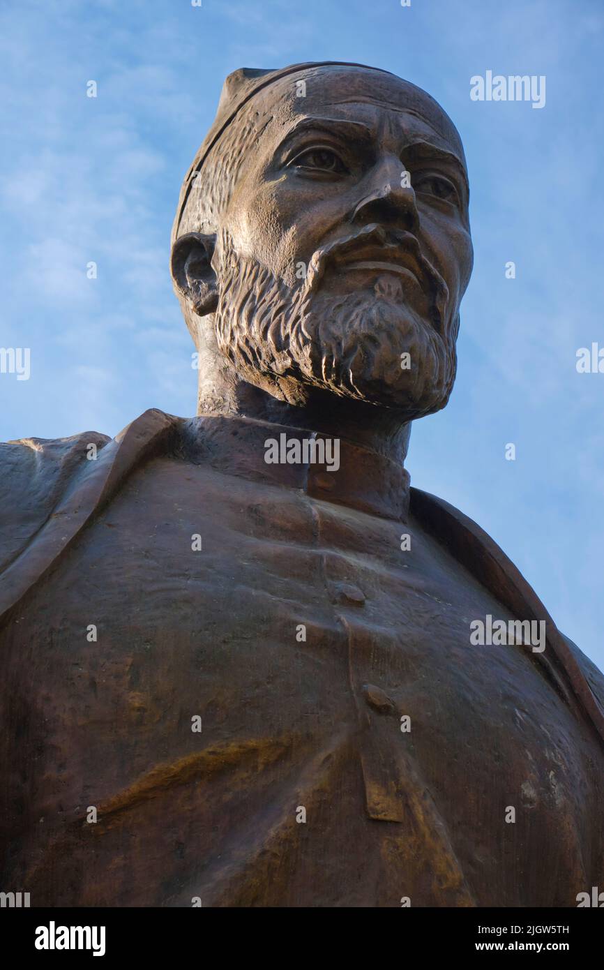 A bronze statue of a sitting Muqimiy, famous writer and critic. At ...