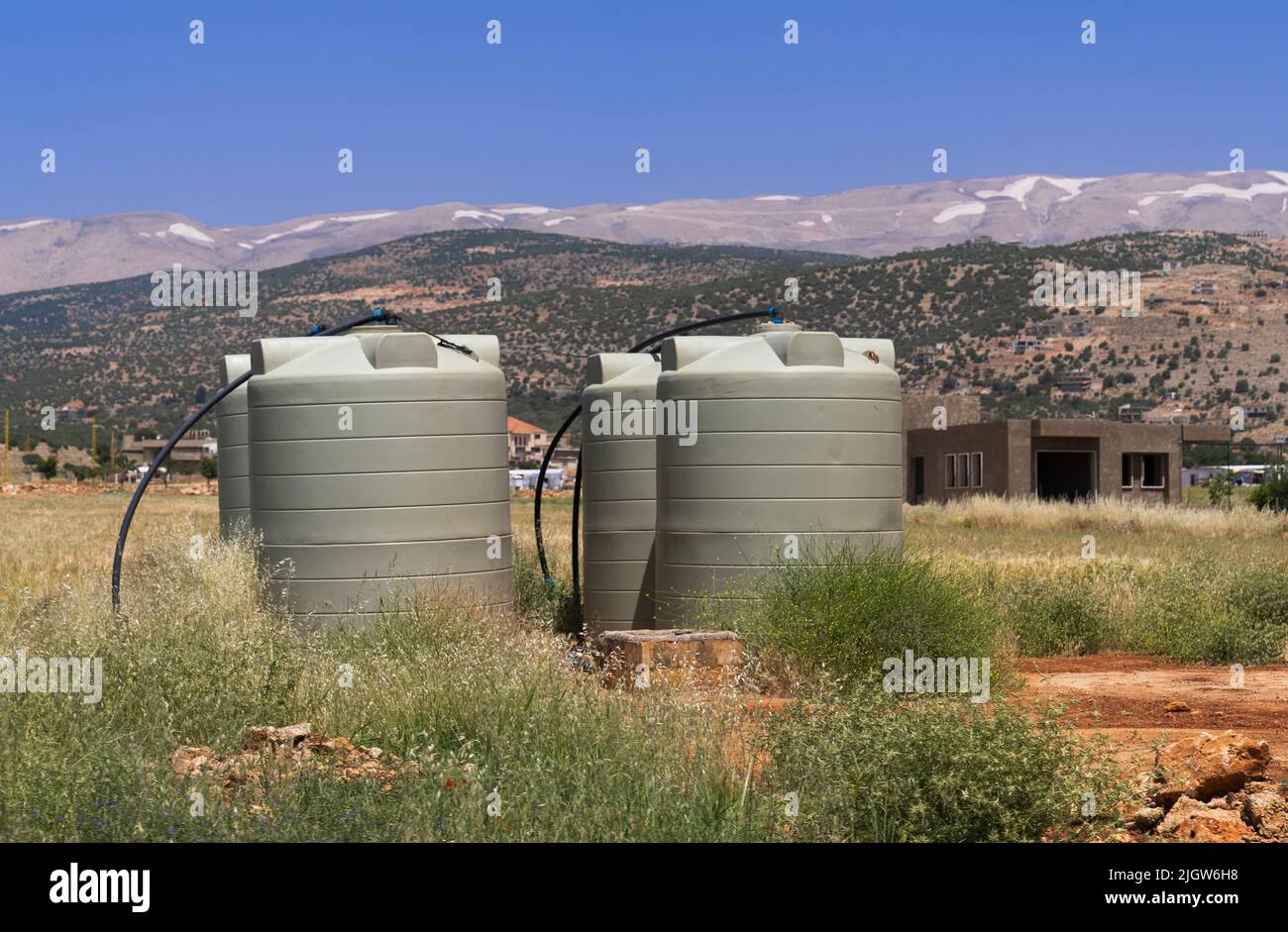 Water tanks in a field, Baalbek-Hermel Governorate, Baalbek, Lebanon ...