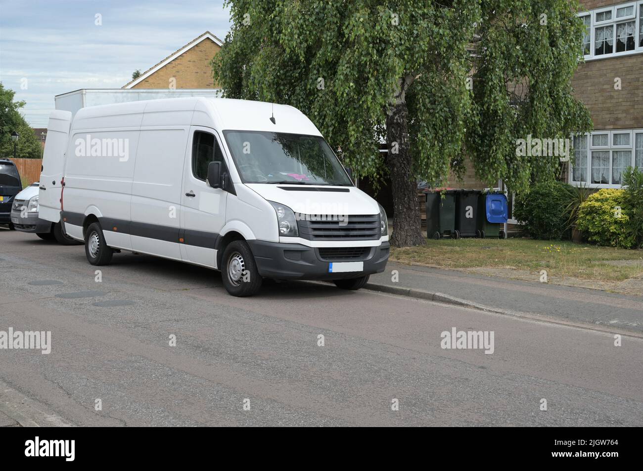 A large white removal van parked in the road Stock Photo - Alamy