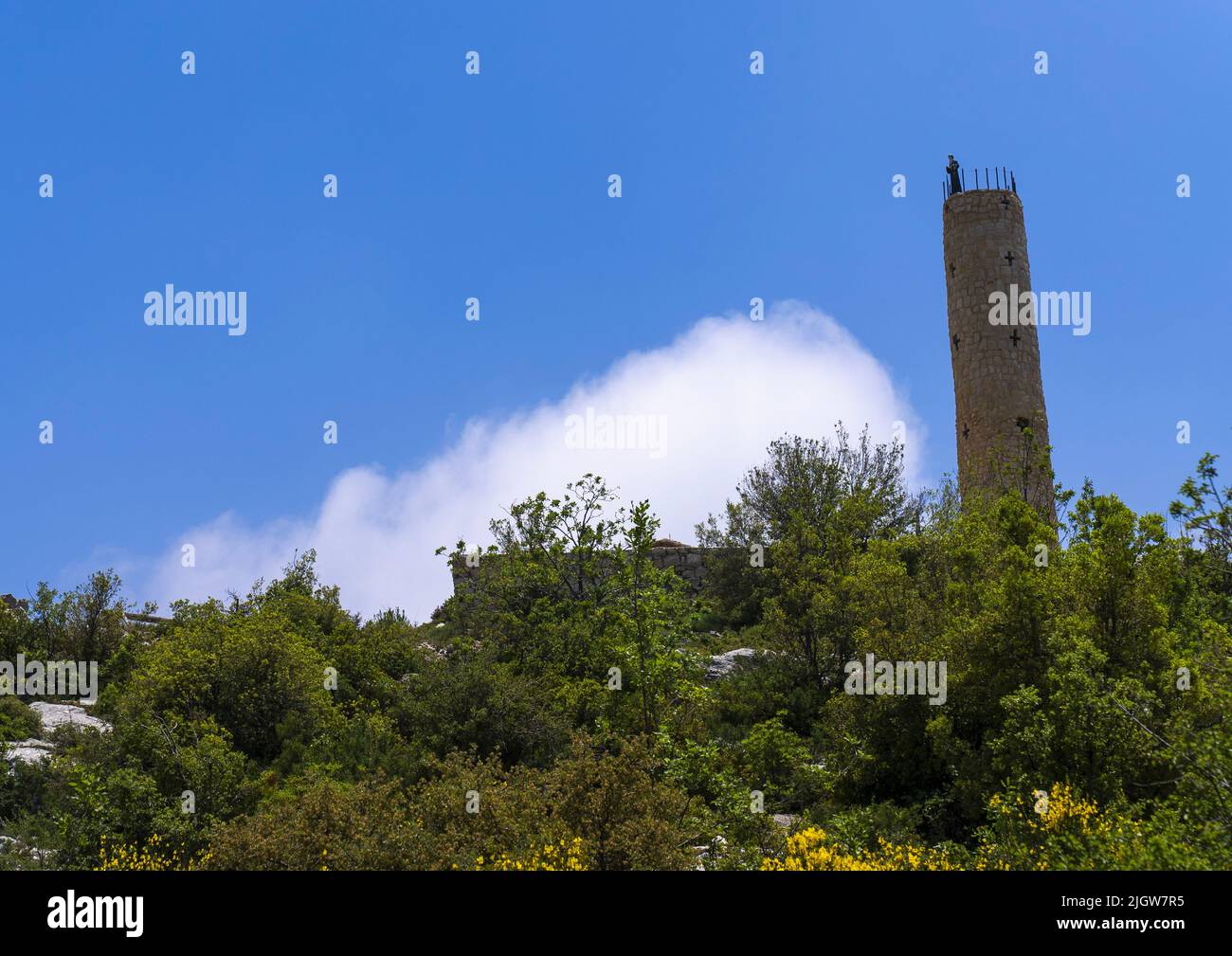 Christian statue at the top of a tower on a hill, North Lebanon ...