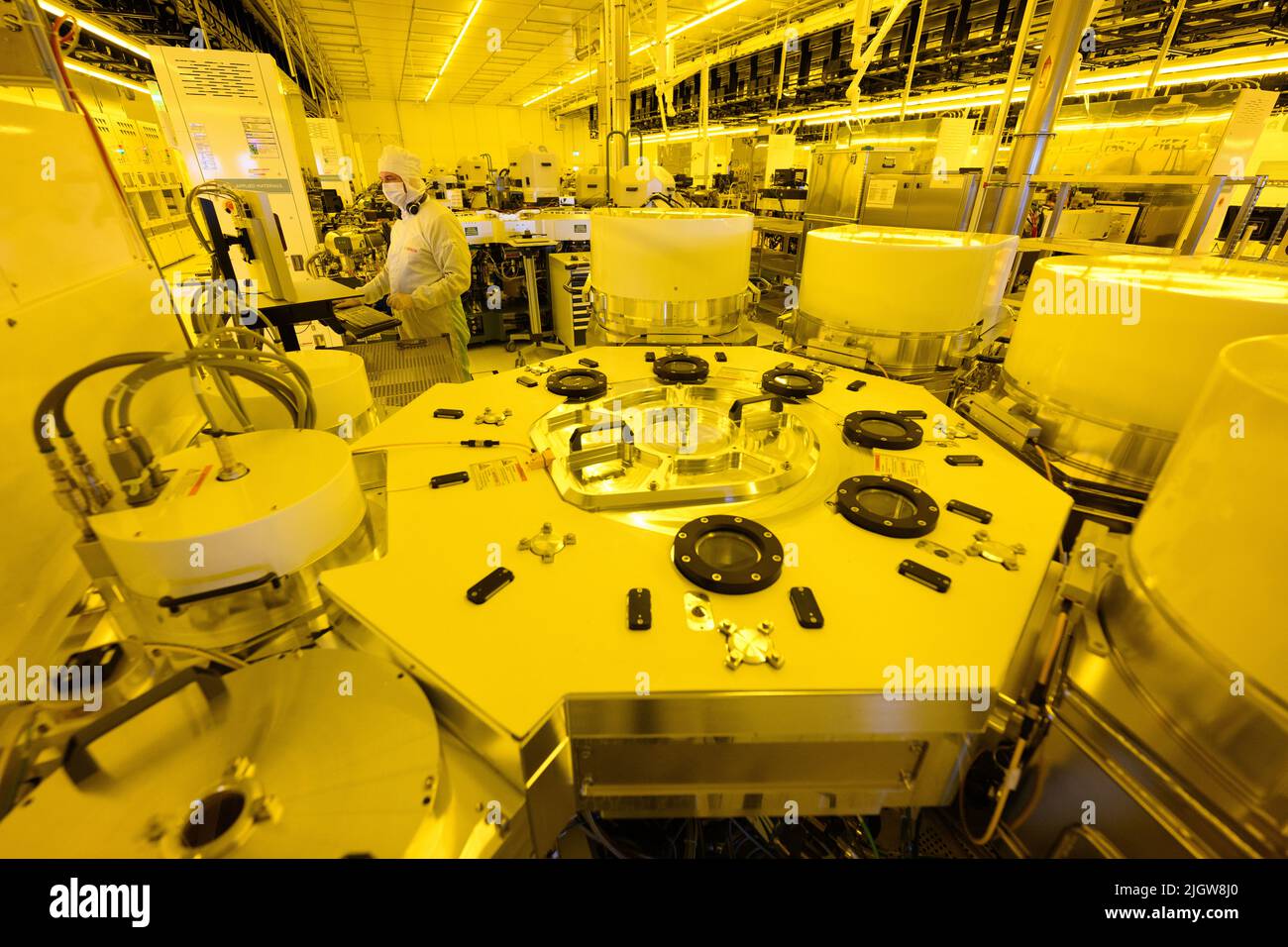 Dresden, Germany. 12th July, 2022. An associate stands at a machine for ...