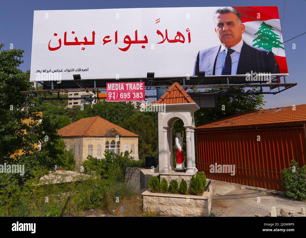 Political propaganda billboard near a Virgin Maria statue, Beqaa ...