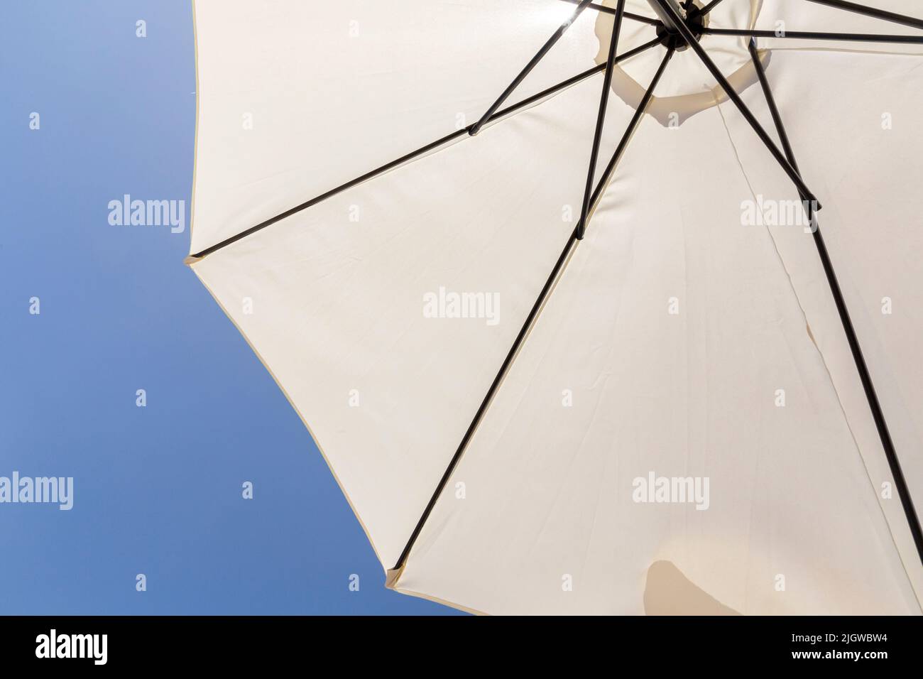detail of parasol under clear blue sky Stock Photo - Alamy