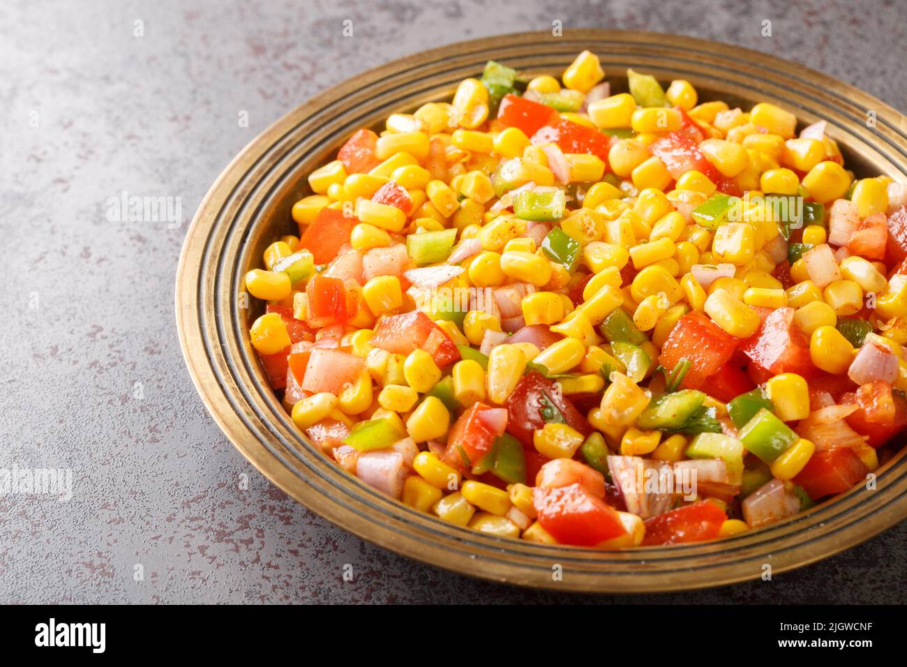 Sweet Corn Chat or Steamed yellow sweet corn, Chat Masala on a plate ...