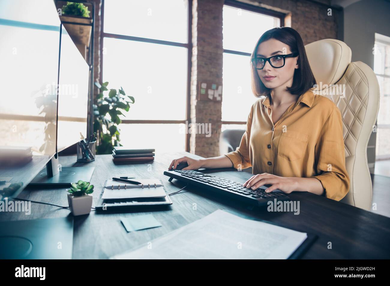 Portrait of attractive clever smart girl qualified cyber editor writing ...