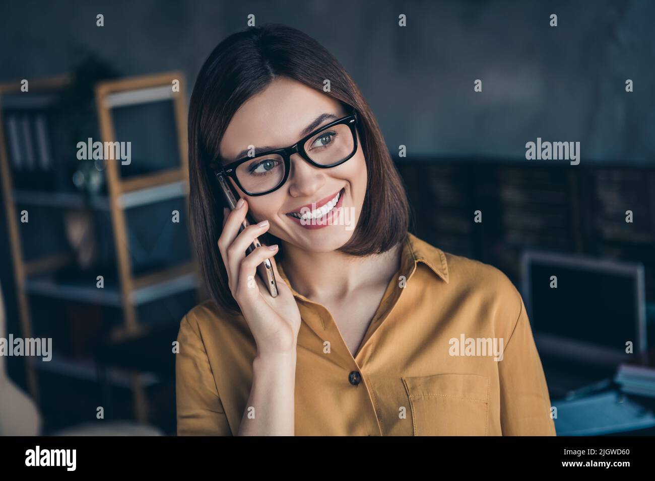 Portrait of beautiful cheerful girl talking on phone discussing ...
