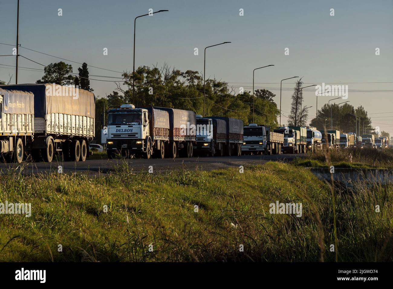 A view of heavy traffic of loaded trucks over a route leading to ... A view of heavy traffic of loaded trucks over a route leading to ...
