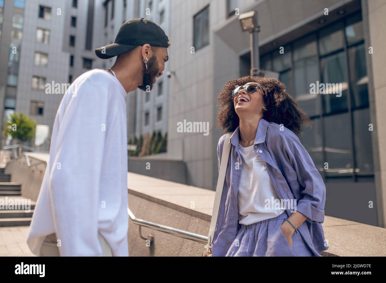 Curly haired woman laughing in hi-res stock photography and images - Alamy