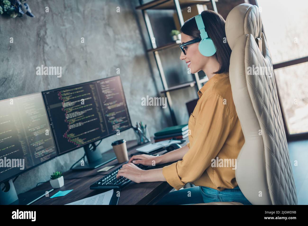 Profile side view portrait of attractive cheery girl editing data ...