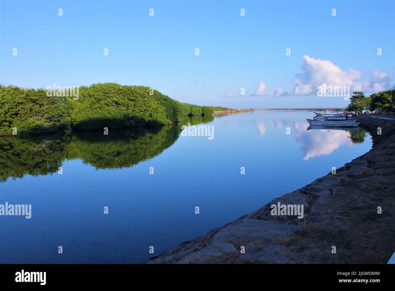 A blue lagoon forms a kind of mirror of water in a tourist site Stock ...