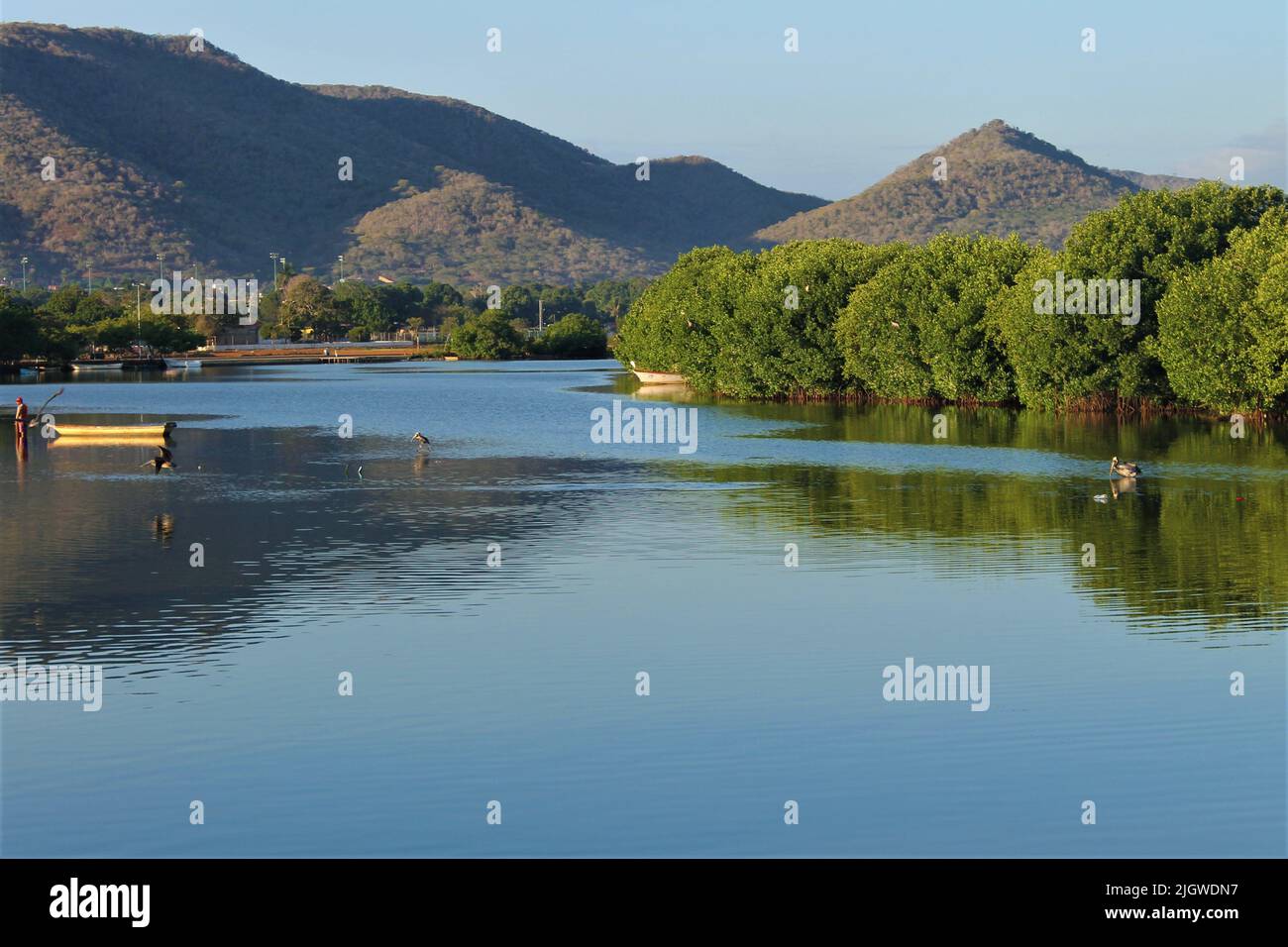 A blue lagoon forms a kind of mirror of water in a tourist site Stock ...