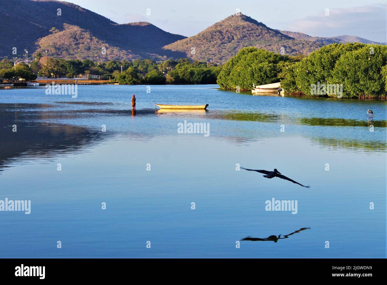 A blue lagoon forms a kind of mirror of water in a tourist site Stock ...