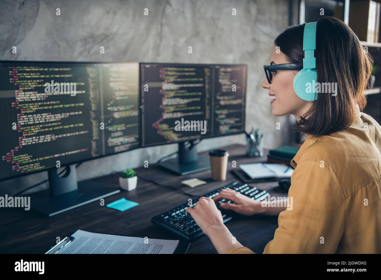 Profile side view portrait of attractive cheery focused girl editing ...