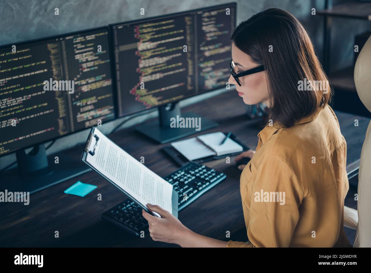 Profile side view portrait of attractive focused girl web developer ...