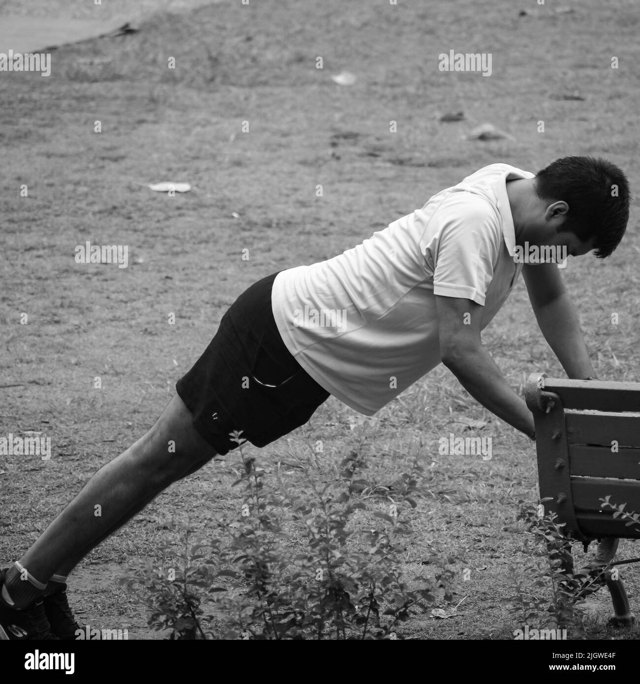 Inspired Indian young man doing yoga asanas in Lodhi Garden Park, New ...