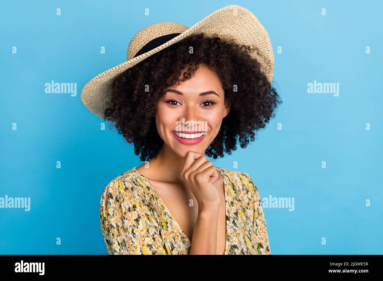 Portrait of attractive cheerful wavy-haired girl posing wearing panama ...