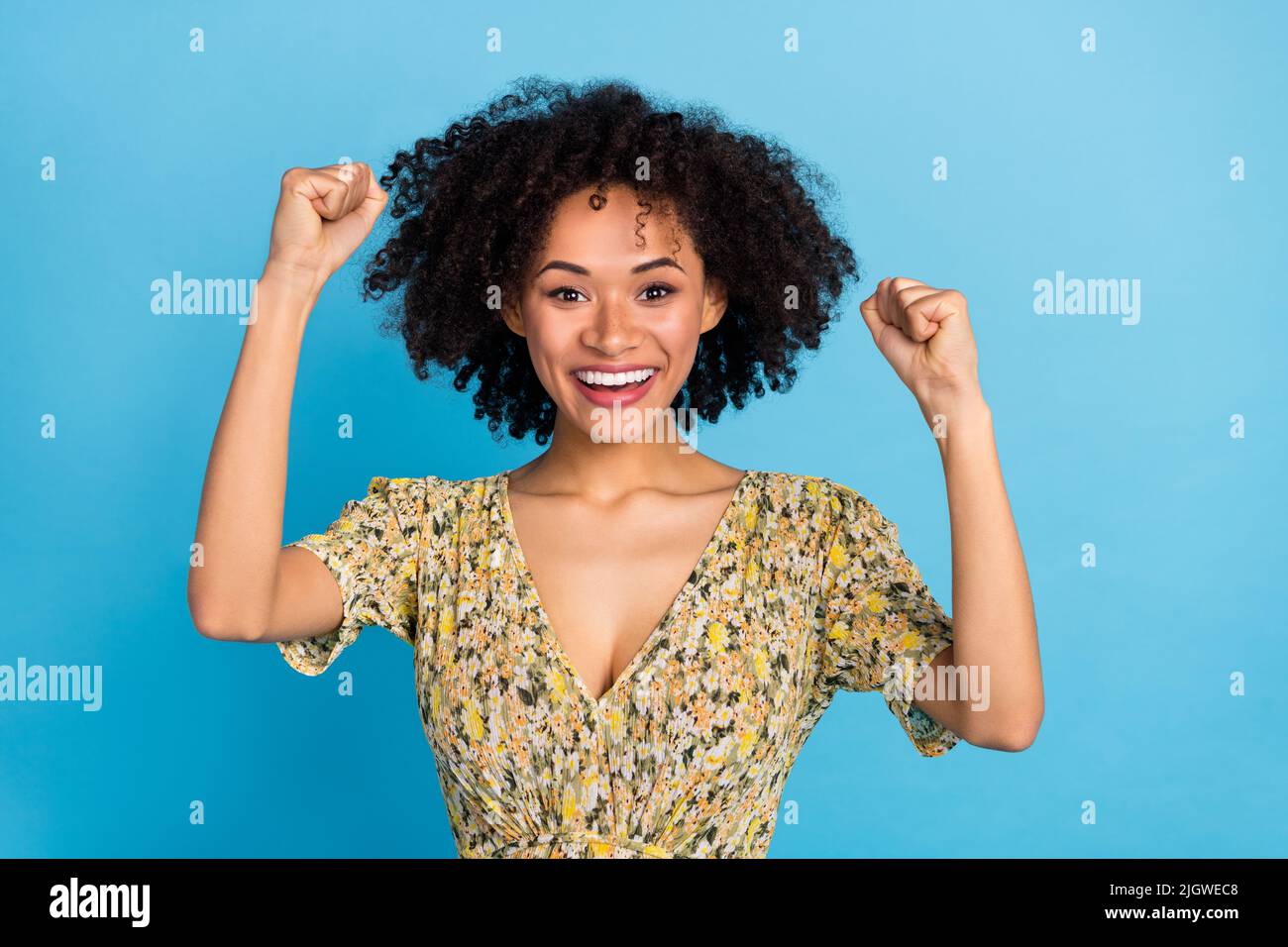 Portrait of attractive lucky cheerful wavy-haired girl rejoicing having ...