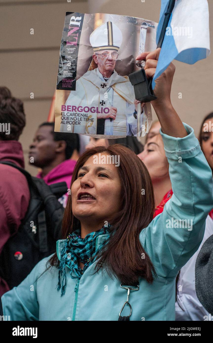 A vertical of crowd cheering and celebrating Archbishop Jorge Bergoglio ...