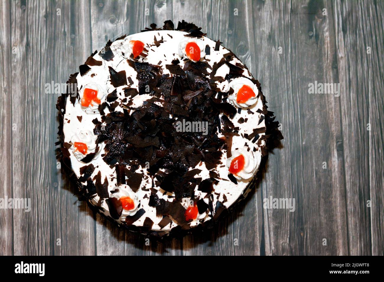 A black forest cake, a light chocolate sponge cake, soaked with cherry ...