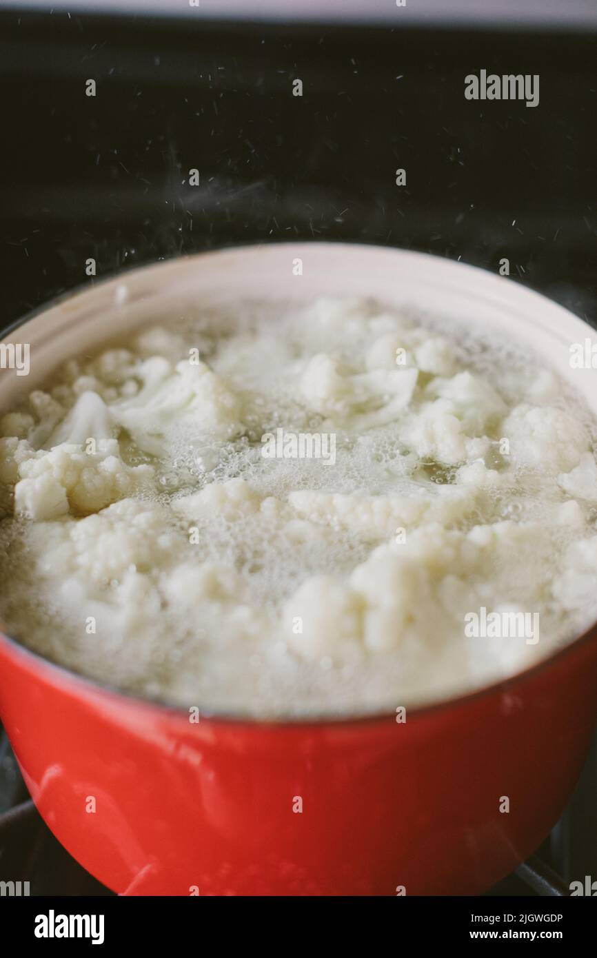 The cauliflower boiling in a saucepan Stock Photo - Alamy