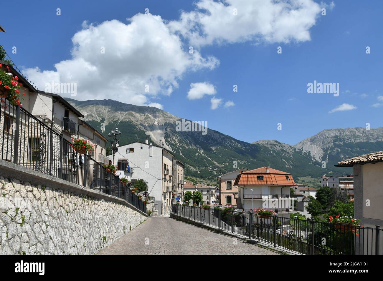 A street among the old stone houses of Campo di Giove, a medieval ...