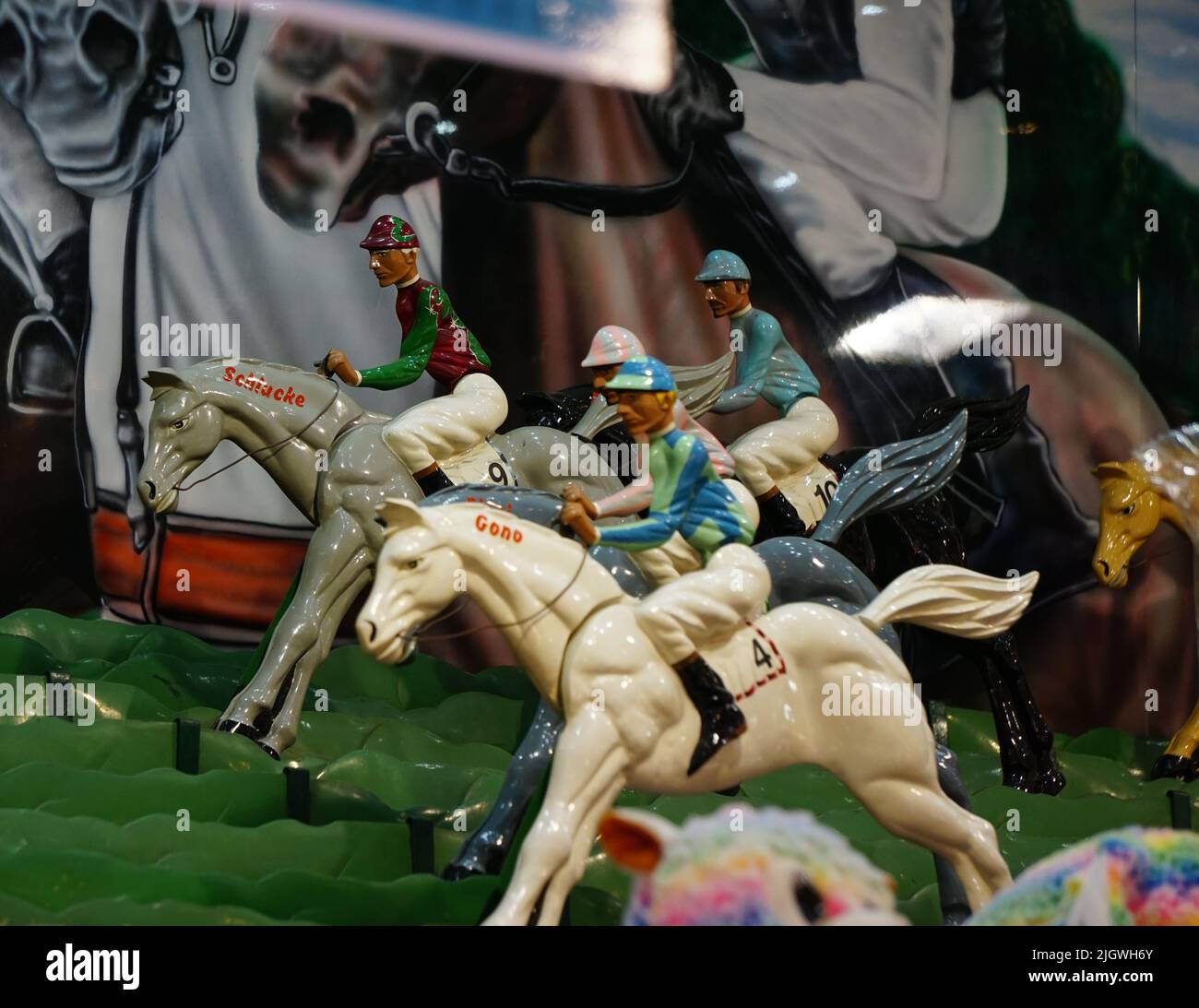 The models of horse riders in the amusement park Stock Photo - Alamy