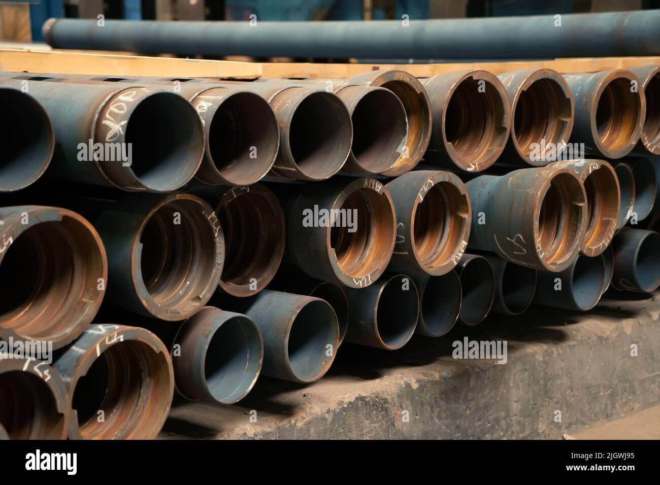 New cast iron pipes with for pipeline close up Stock Photo - Alamy