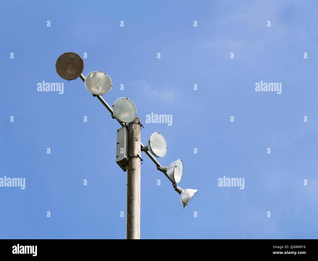 Lamp post of spotlights public stadium on blue sky Stock Photo - Alamy