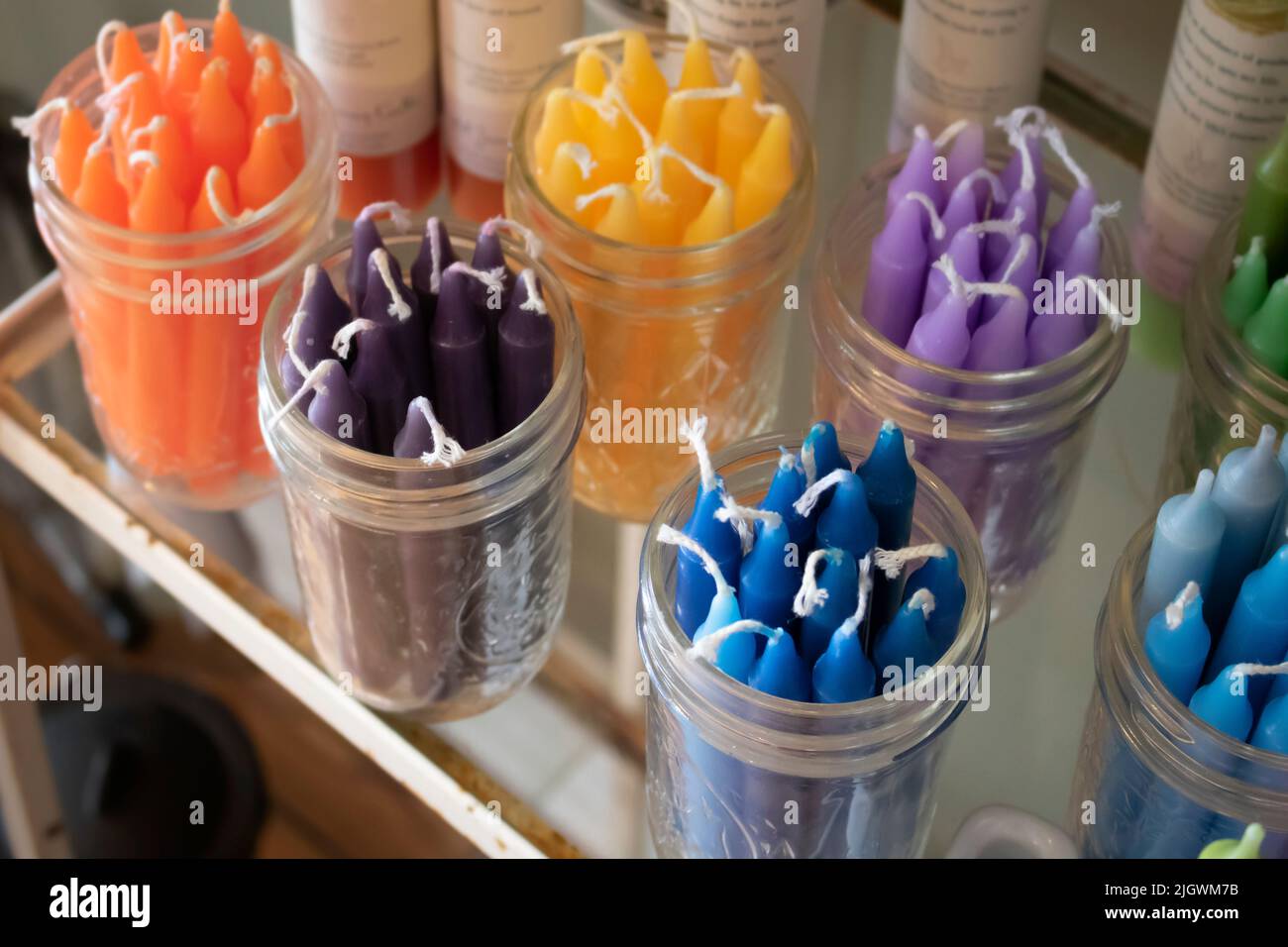 special events or holilday colorful candles in jars at a shop for sale ...