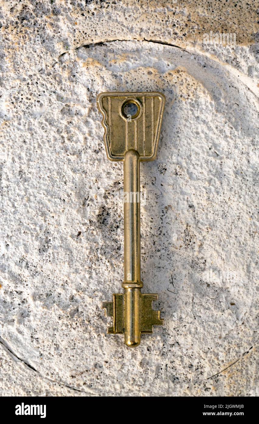 fence shot of antique bronze key on rough surface Stock Photo - Alamy