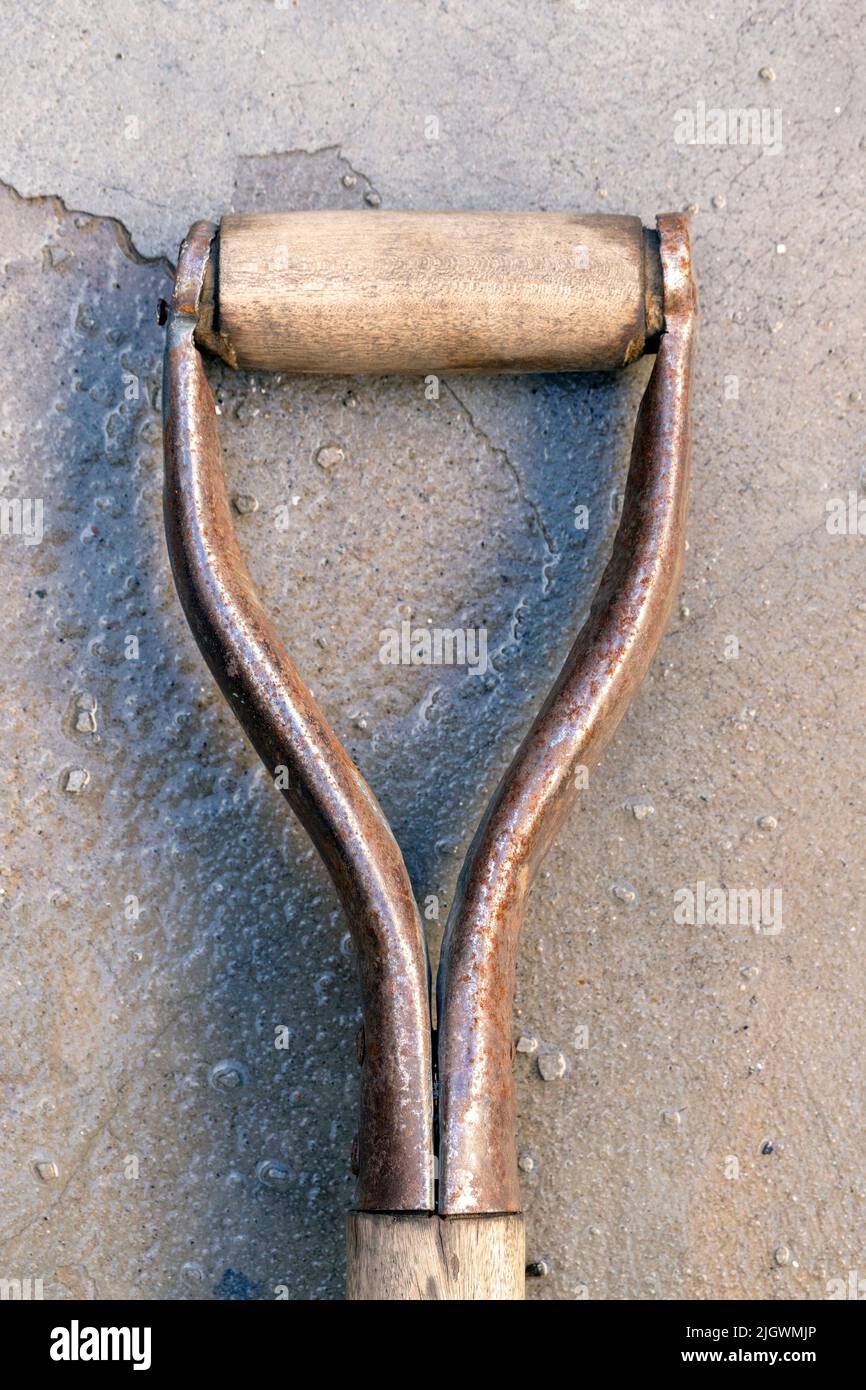 photograph of old shovel or rake handle Stock Photo - Alamy