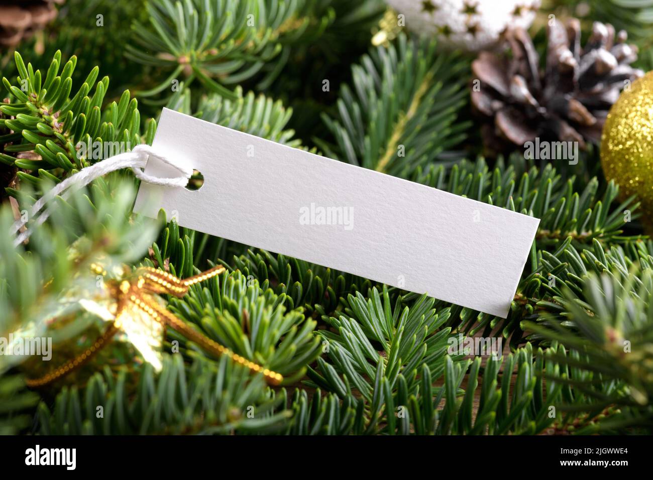 Christmas rectangle strip tag mockup with white cord, close up on ...