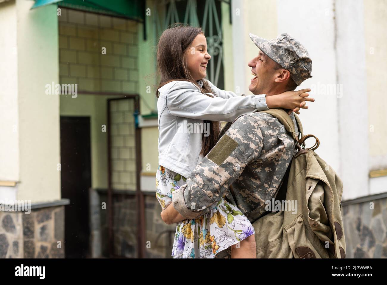 Happy little girl having fun with her military father Stock Photo - Alamy