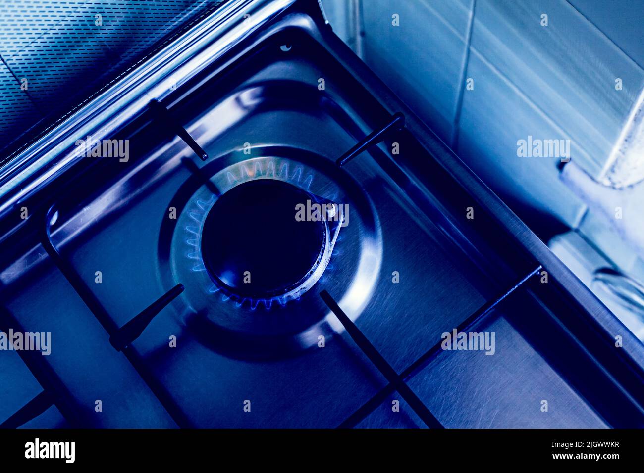 Kitchen gas stove, burner with blue flame Stock Photo - Alamy