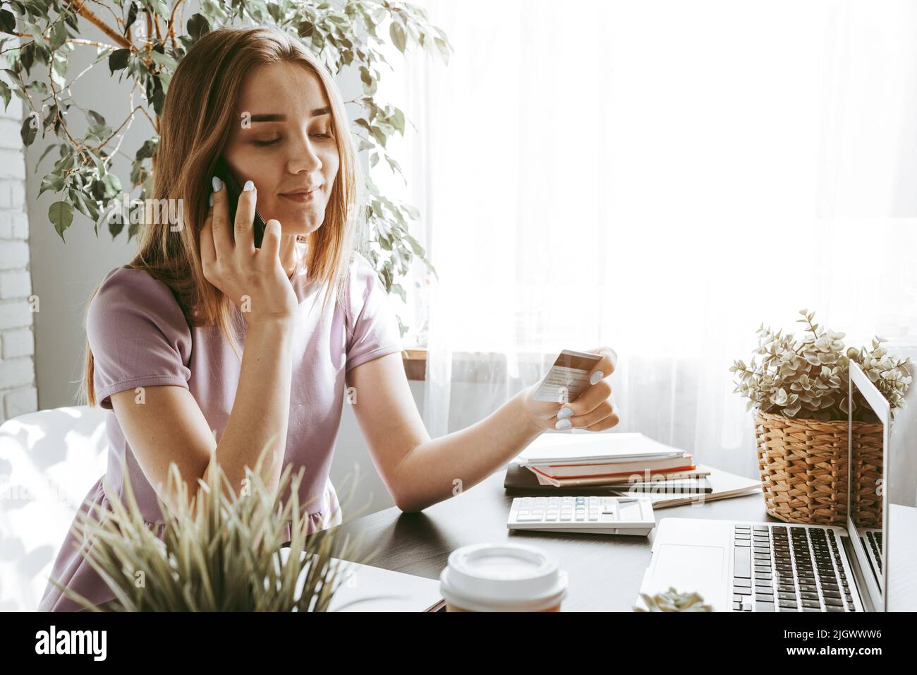 Young beautiful woman using mobile phone in modern office Stock Photo ...