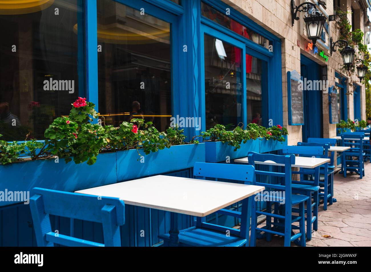 Street cafe in blue tones, empty tables in Istanbul Stock Photo - Alamy