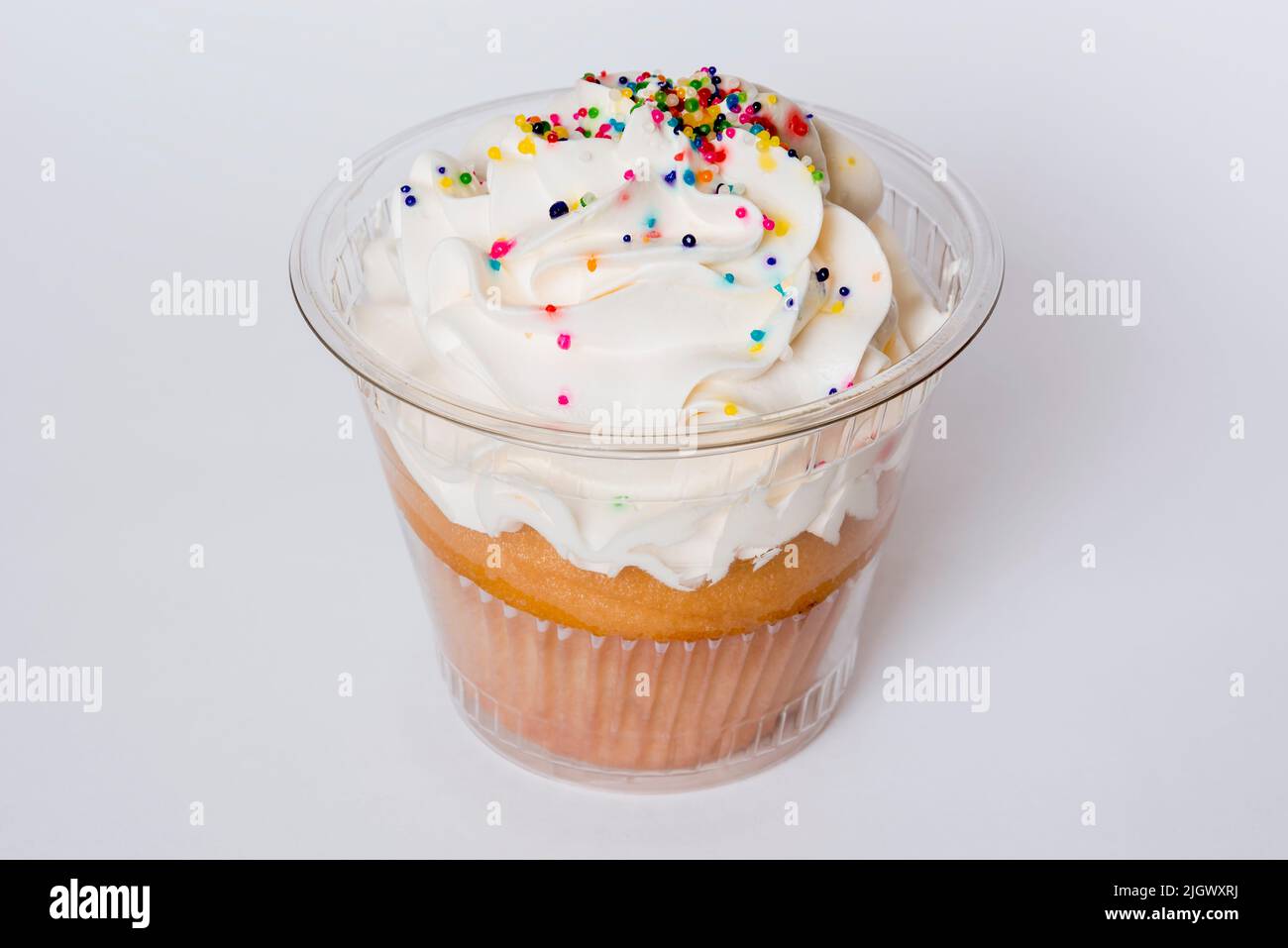 Muffin in paper wrappers inside a clear plastic wrapper isolated on ...