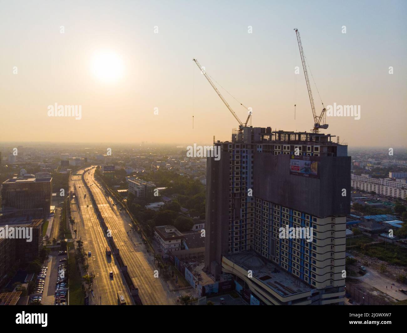 Aerial view morning sunrise city building with transport road cityscape ...