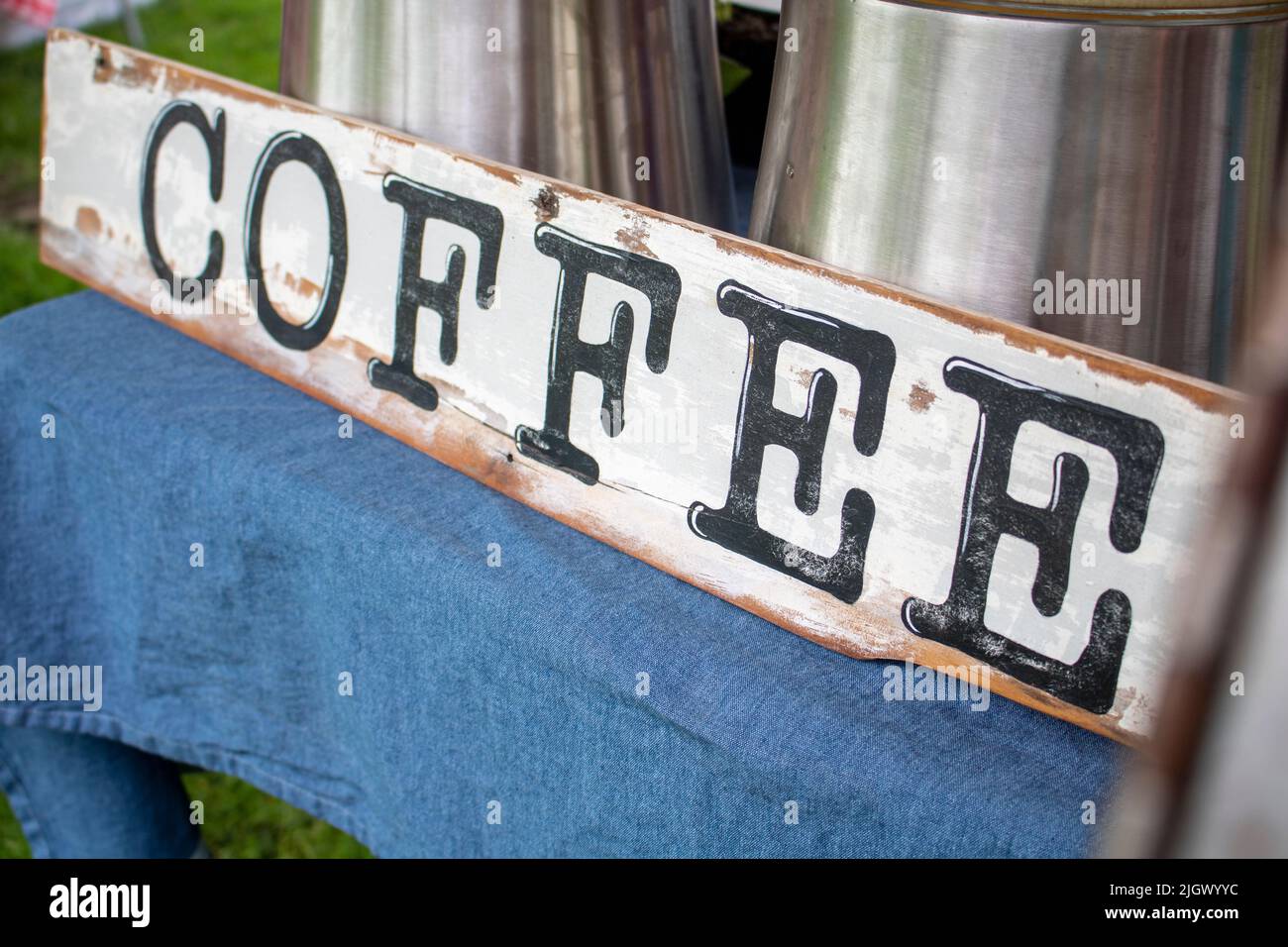 outdoor table with long wooden coffee sign Stock Photo - Alamy