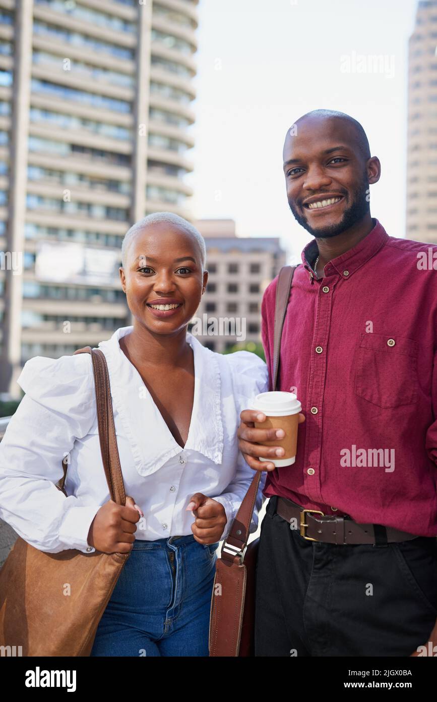 Two Black colleagues arrive at the office in the city for work Stock ...