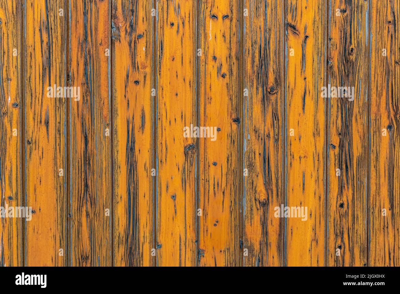 Yellow, vertically oriented planks with chipped yellow color. Texture ...