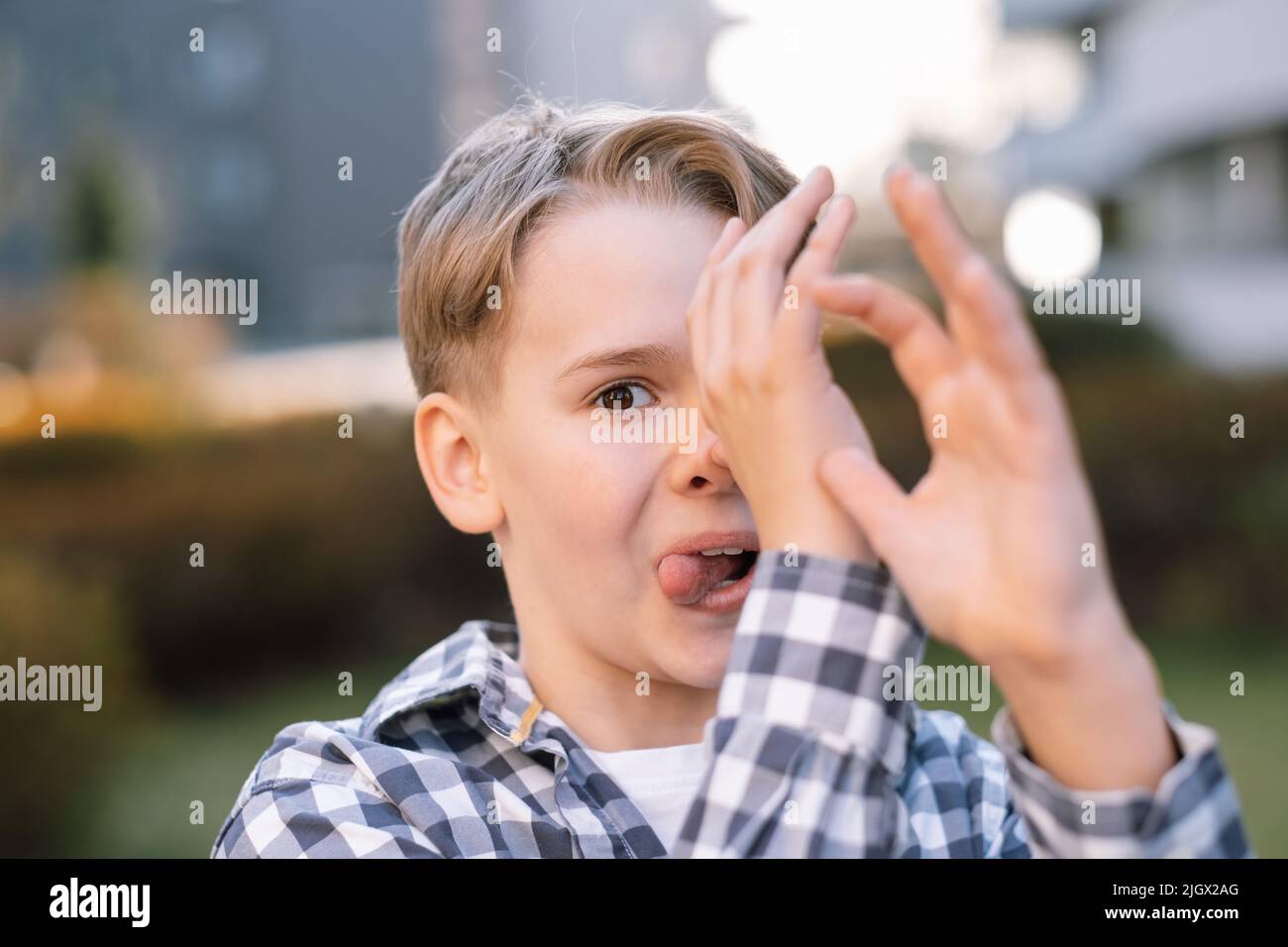 Close up portrait of a young naughty teenager man with a mischievous ...