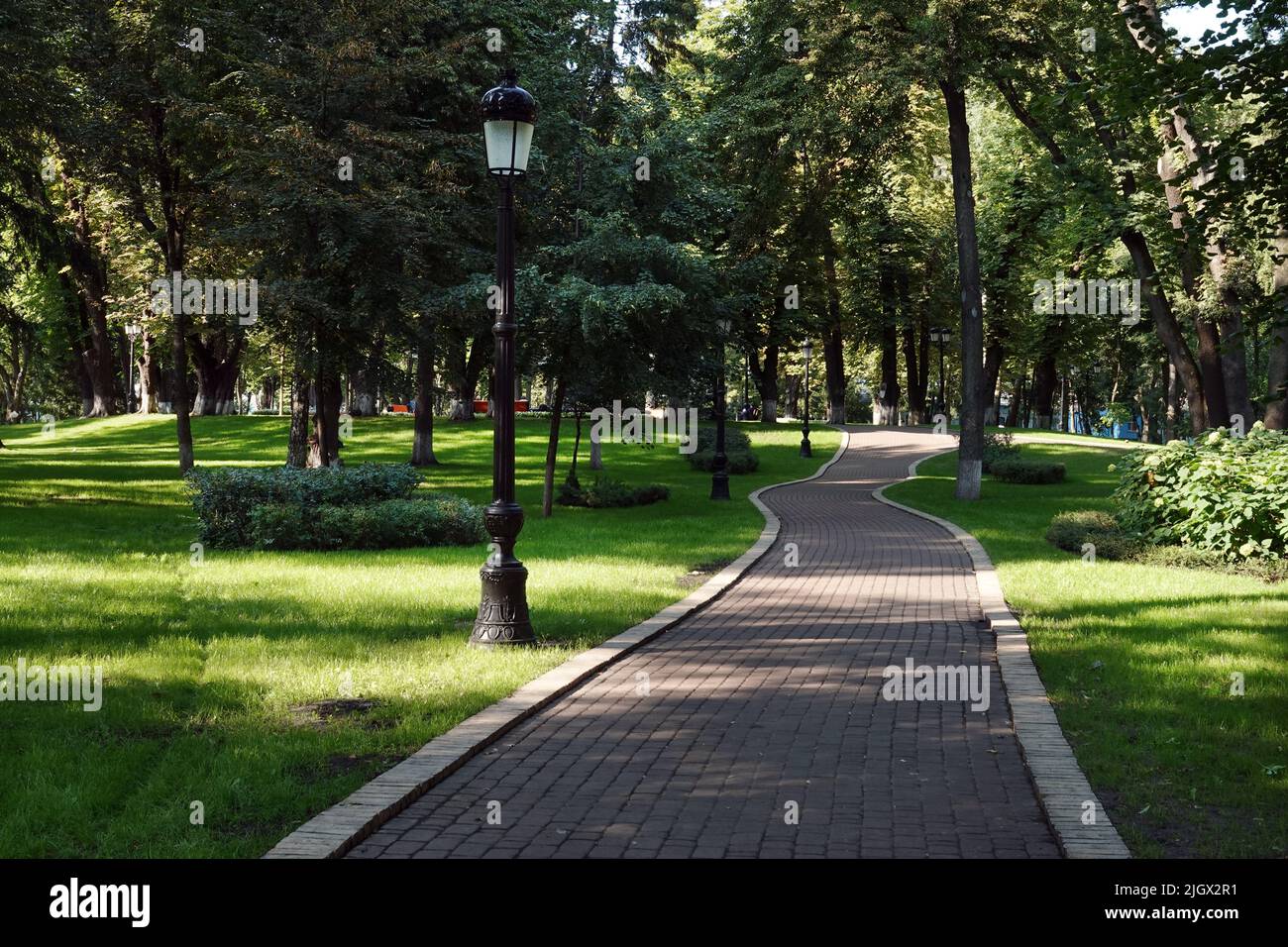 Alleys and paths in the Mariinsky Park of Kiev in summer Stock Photo ...