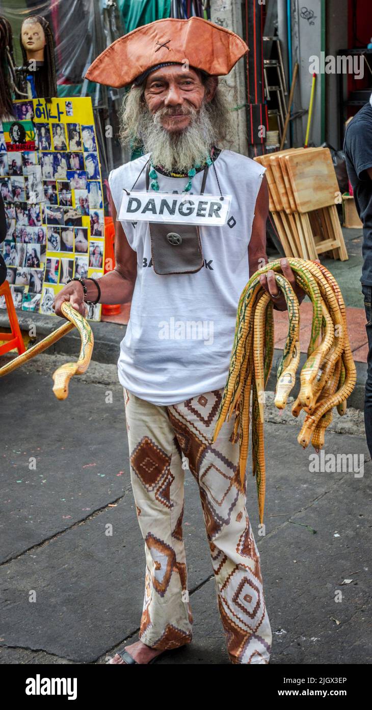 Editorial, Khao San Road vendor selling wooden snakes to tourists. feb ...