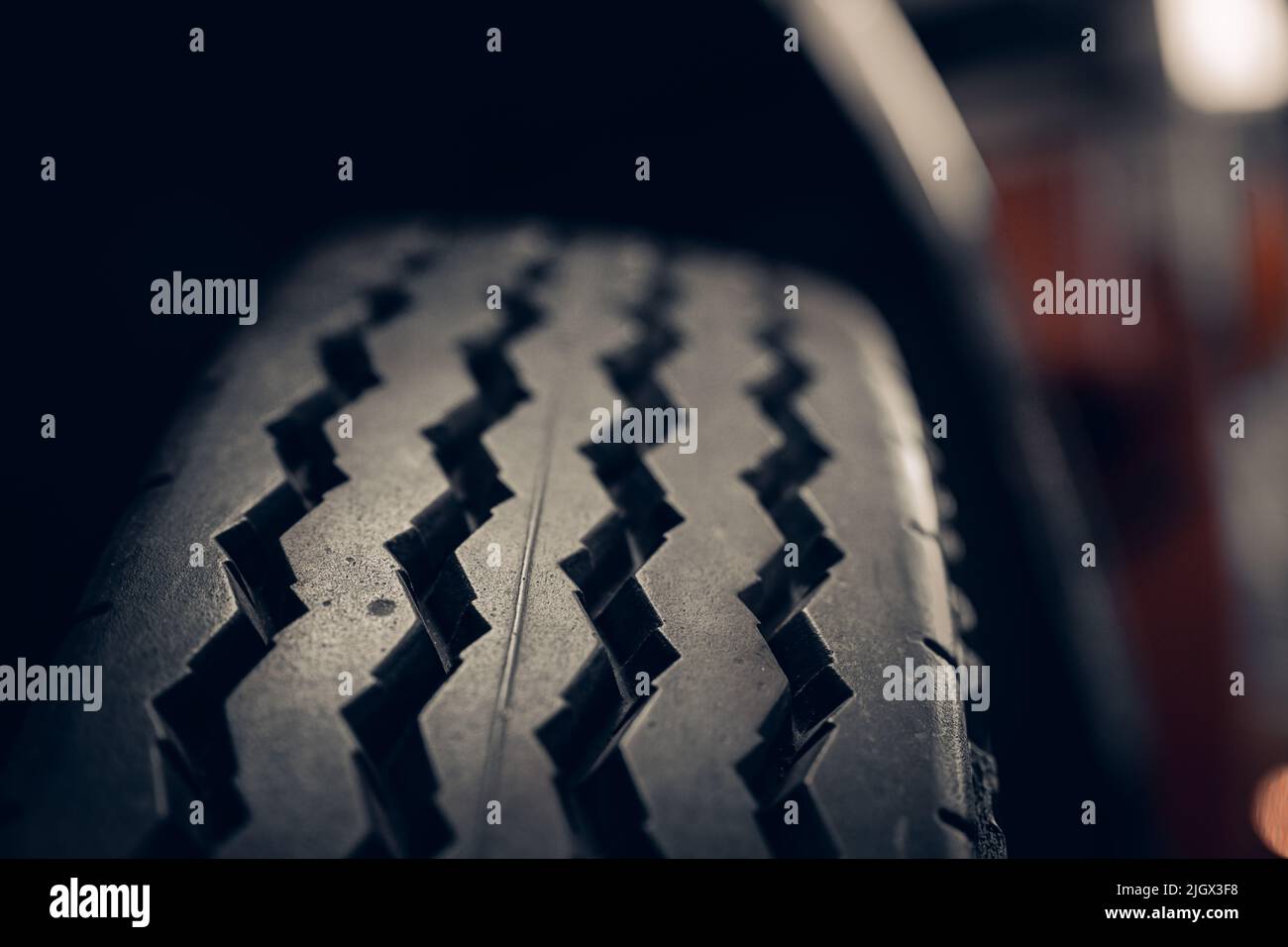 A closeup detail shot of car tire with blur background Stock Photo - Alamy