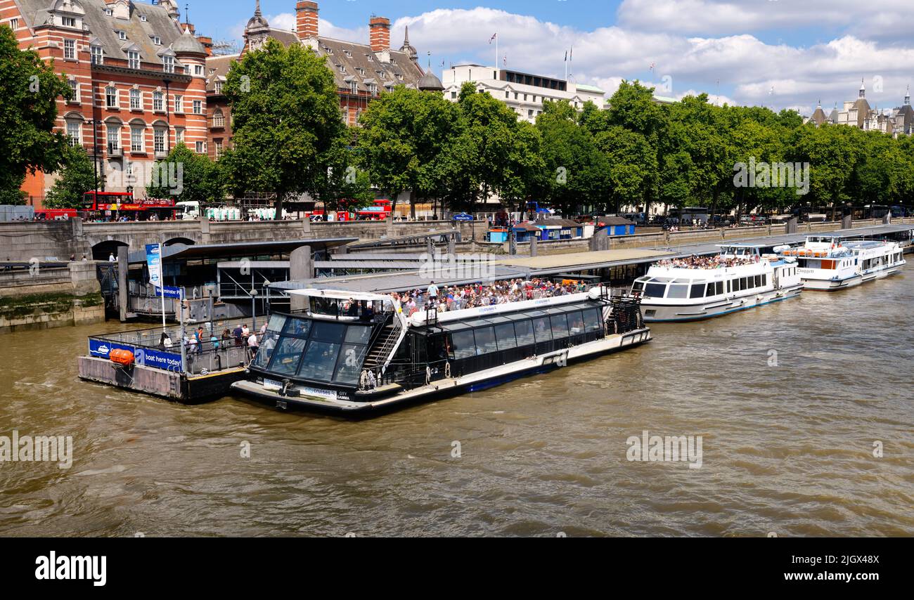 Sightseeing tour boats on the River Thames in the English summer ...