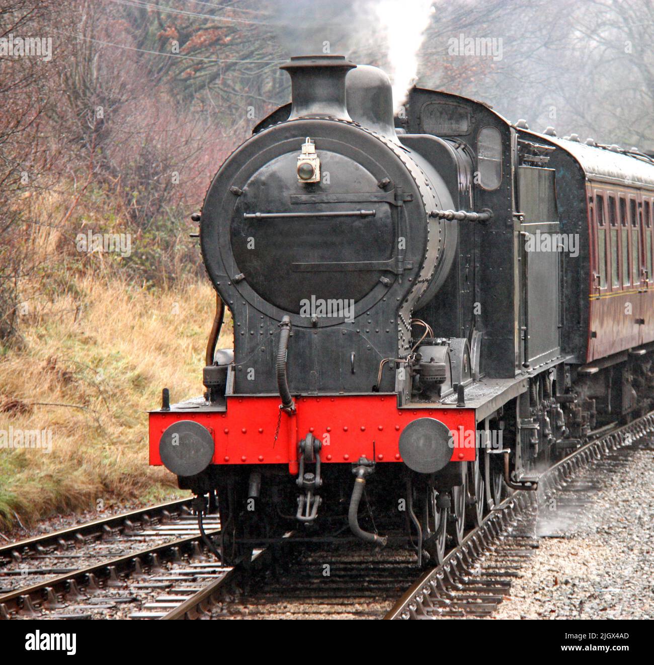A Vintage Steam Engine Pulling Traditional Carriages Stock Photo - Alamy