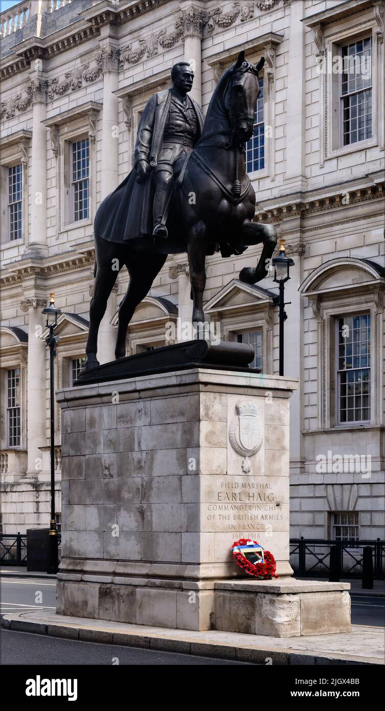 Statue of Field Marshall Earl Haig on horseback with floral garland ...