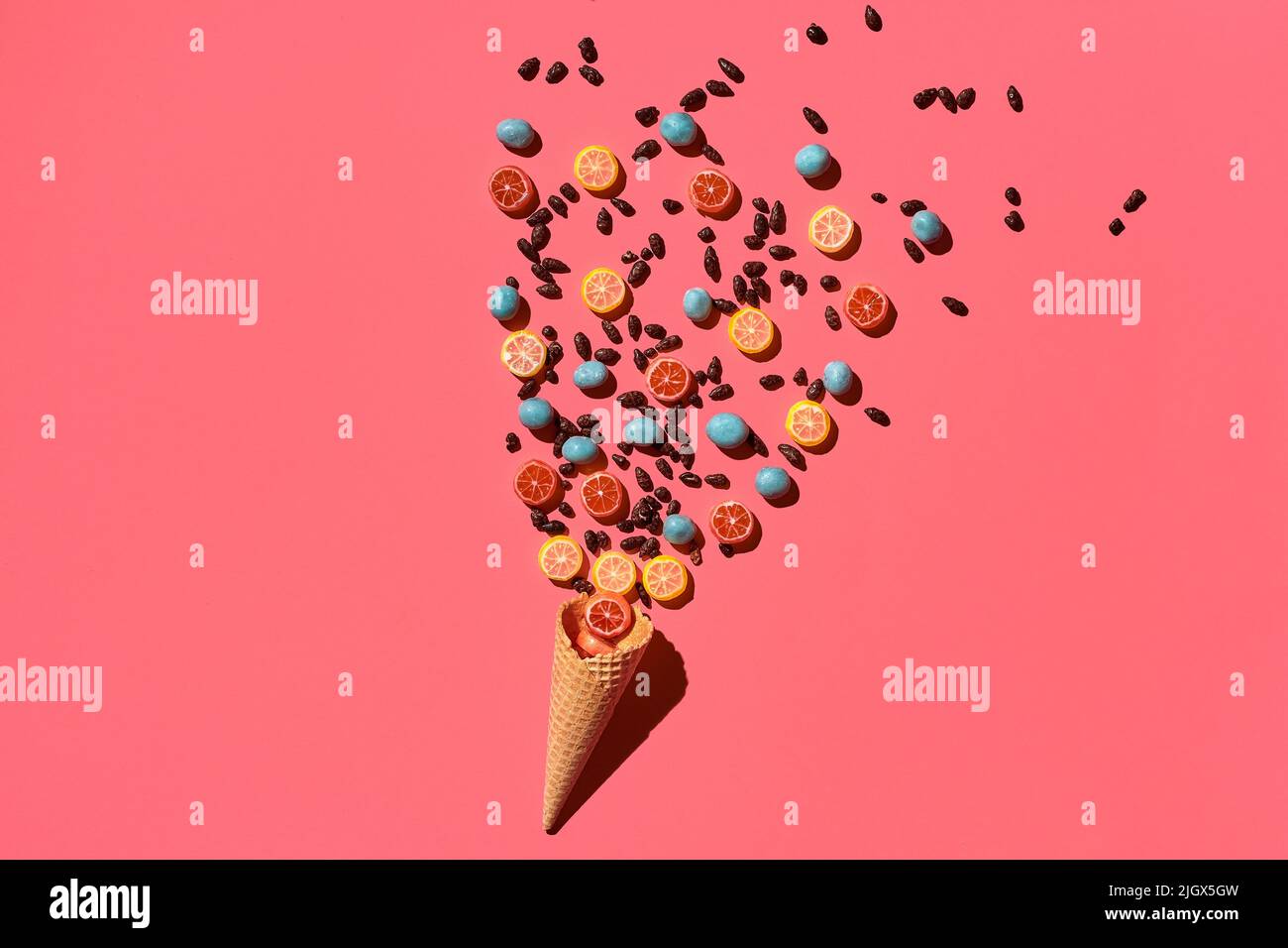 A variety of delicious sweets explode from the waffle cone, view from ...