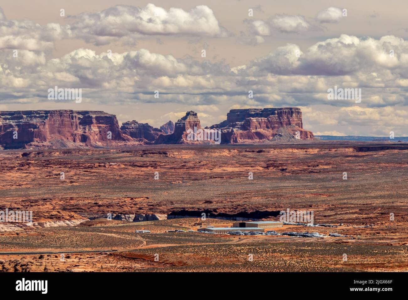 Giant hills and flat man made structures coexist in Page, AZ Stock ...